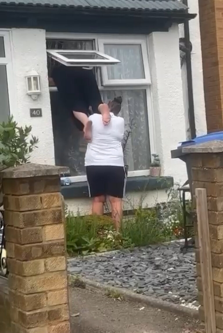 Woman exposes herself falling in window in viral video